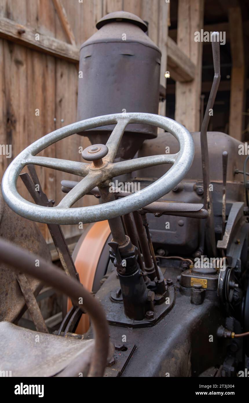 Iron steering wheel of a vintage tractor Stock Photo - Alamy