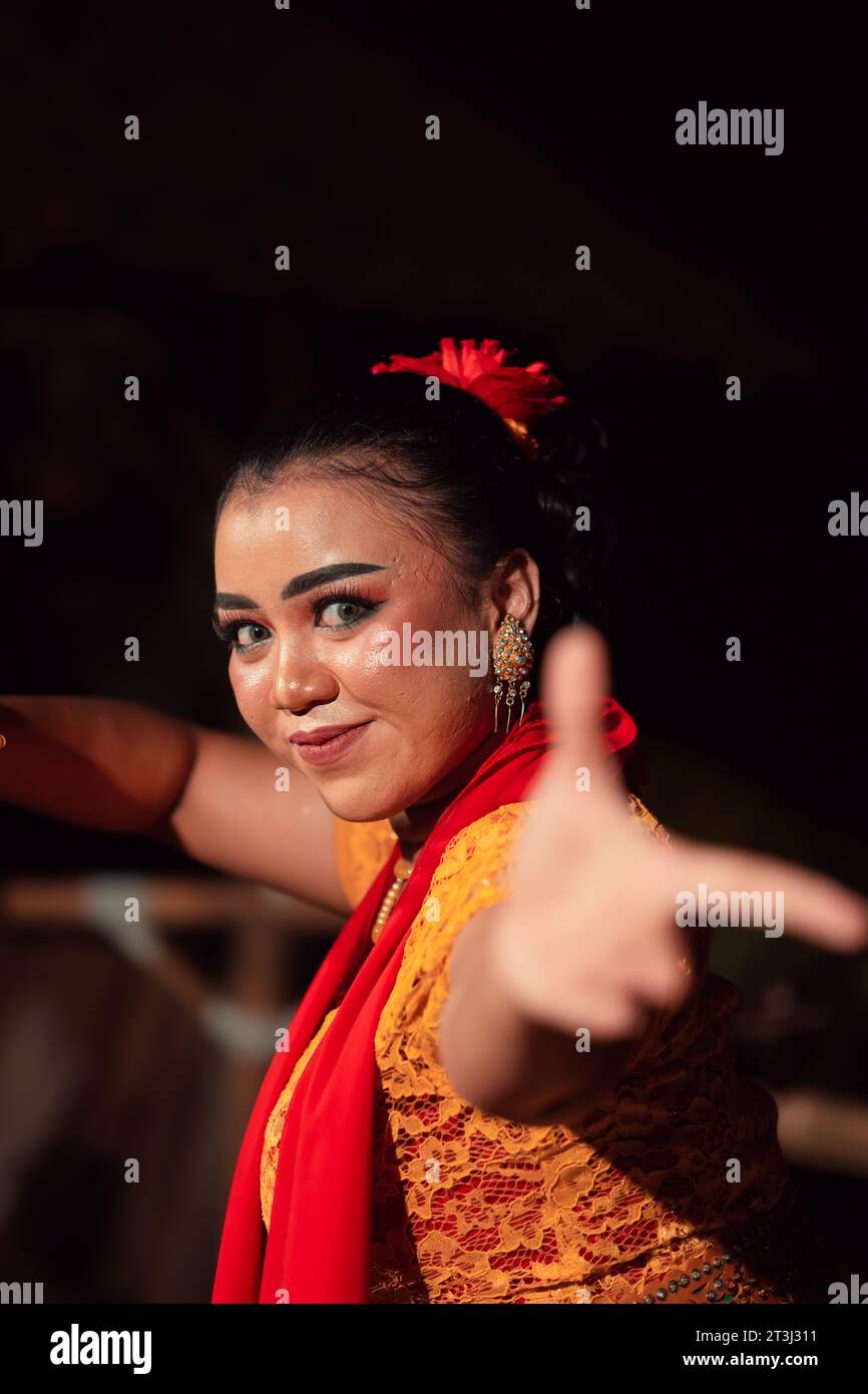 Beautiful face of an Indonesian woman in makeup while dancing a ...