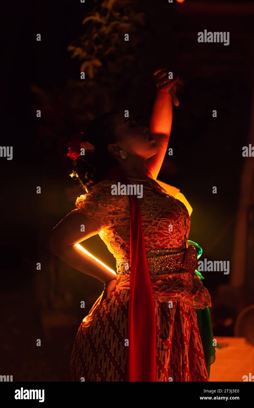 Balinese women wearing cultural clothes while posing in front of the ...