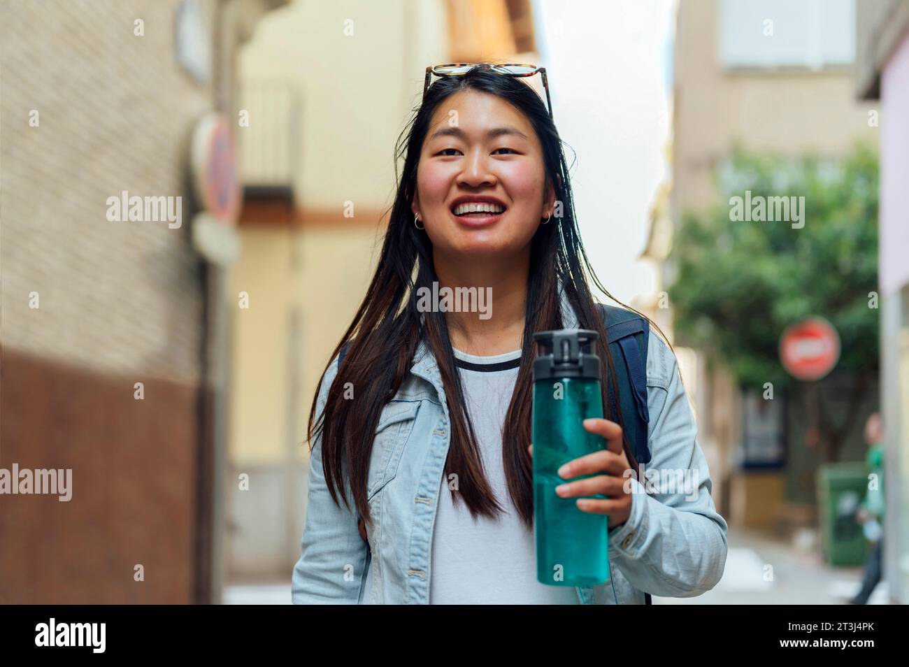 Happy asian woman walking in granada.Spain Stock Photo - Alamy