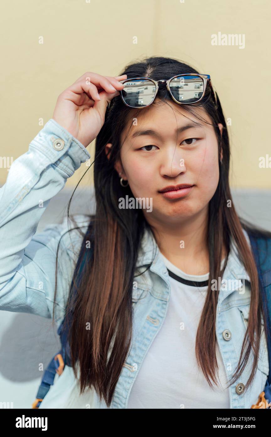 Portrait of serious asian woman looking into camera Stock Photo - Alamy