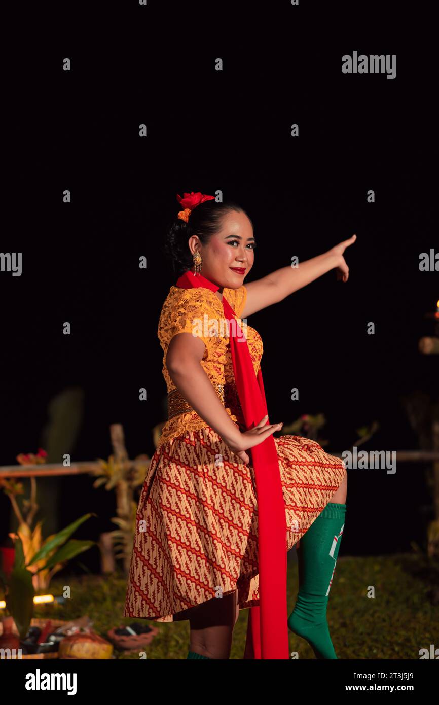 Asian woman performing a traditional dance called jaipong in Indonesia ...