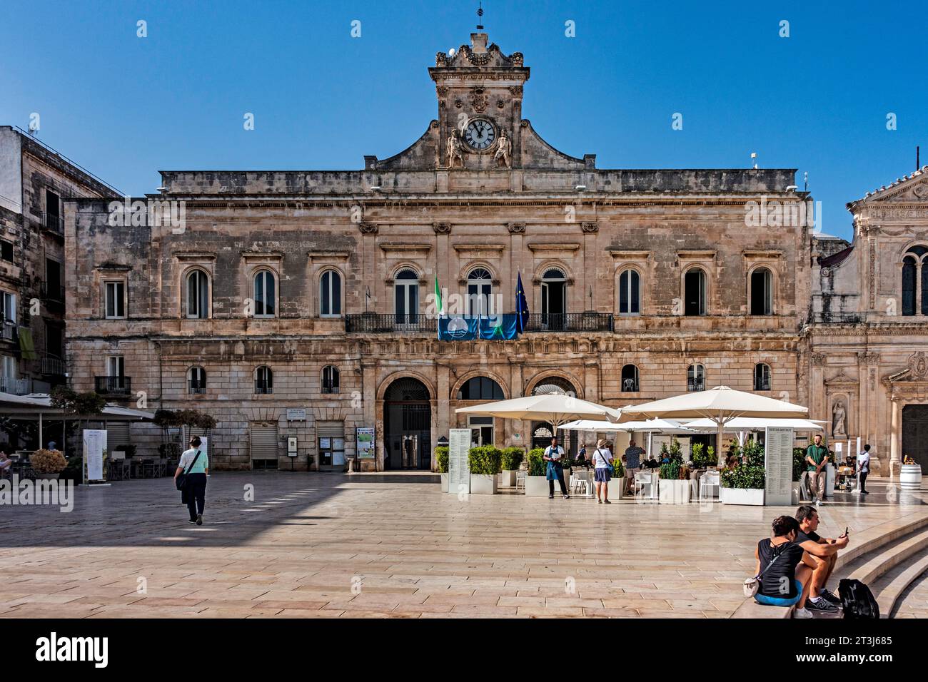 Piazza della Liberta, the main square in Ostuni, Italy. With the town ...
