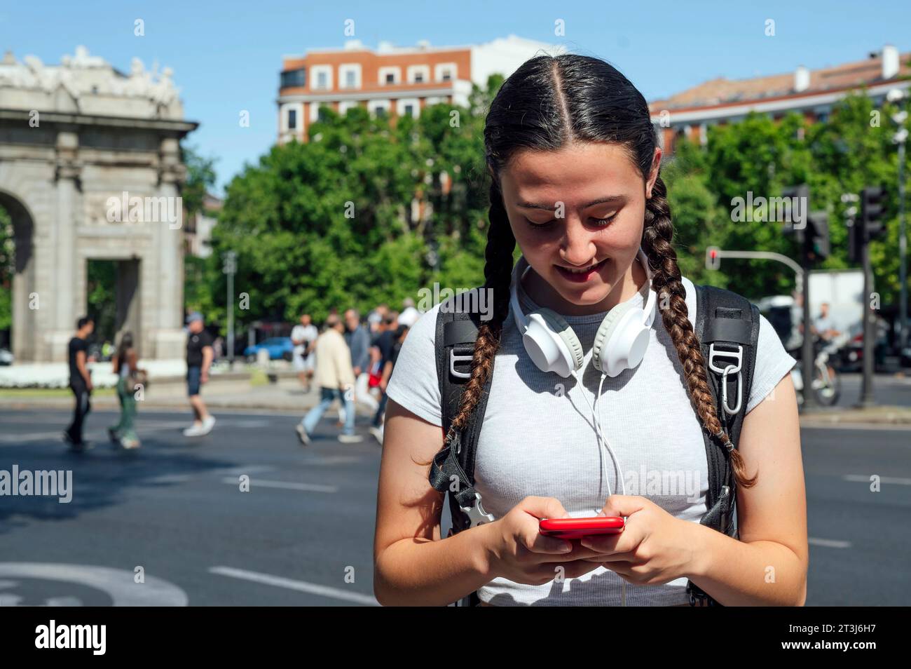 Young woman headphones around neck Stock Photo - Alamy