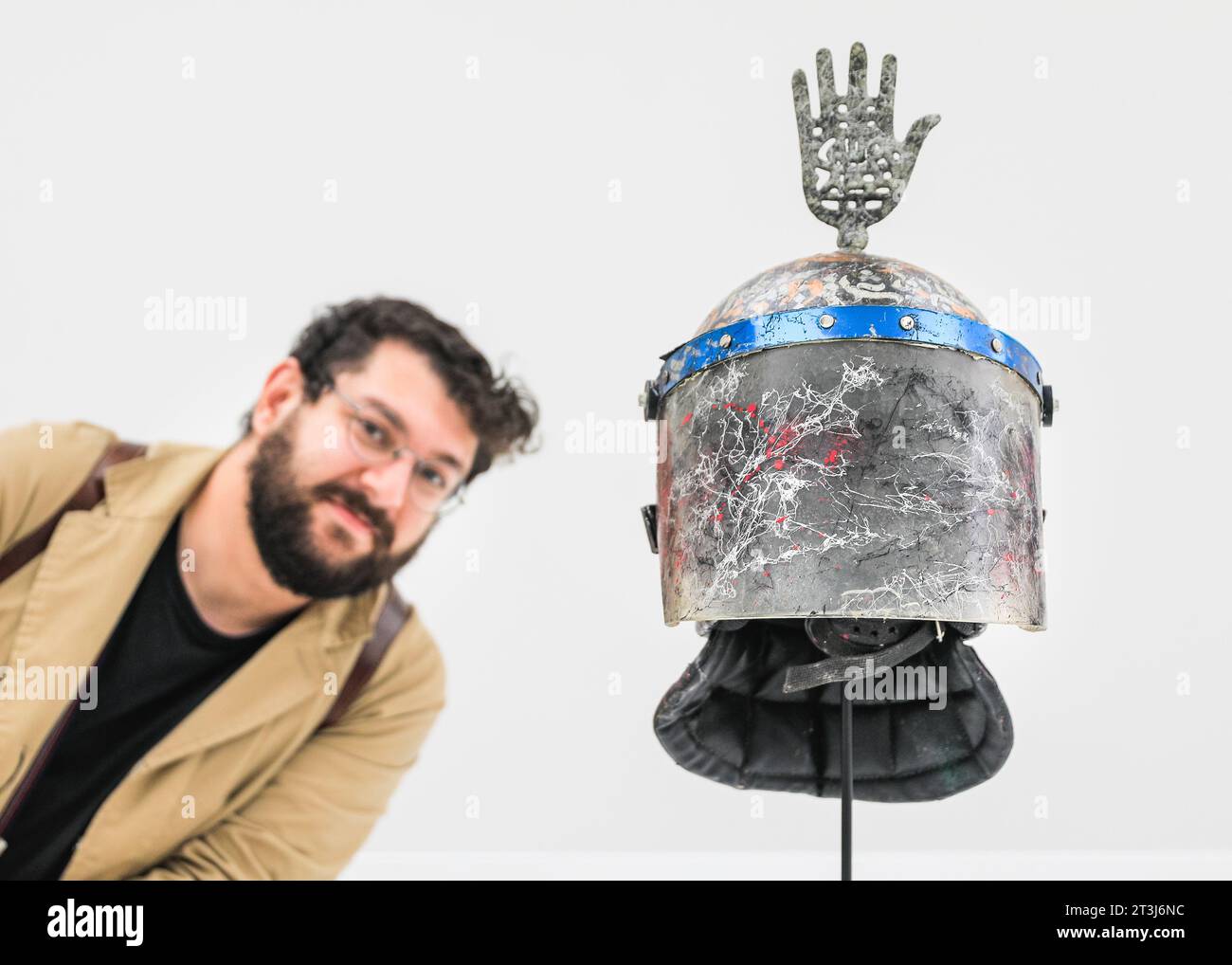 London, UK. 25th Oct, 2023. Artist Parham Ghalamdar with the helmet he ...