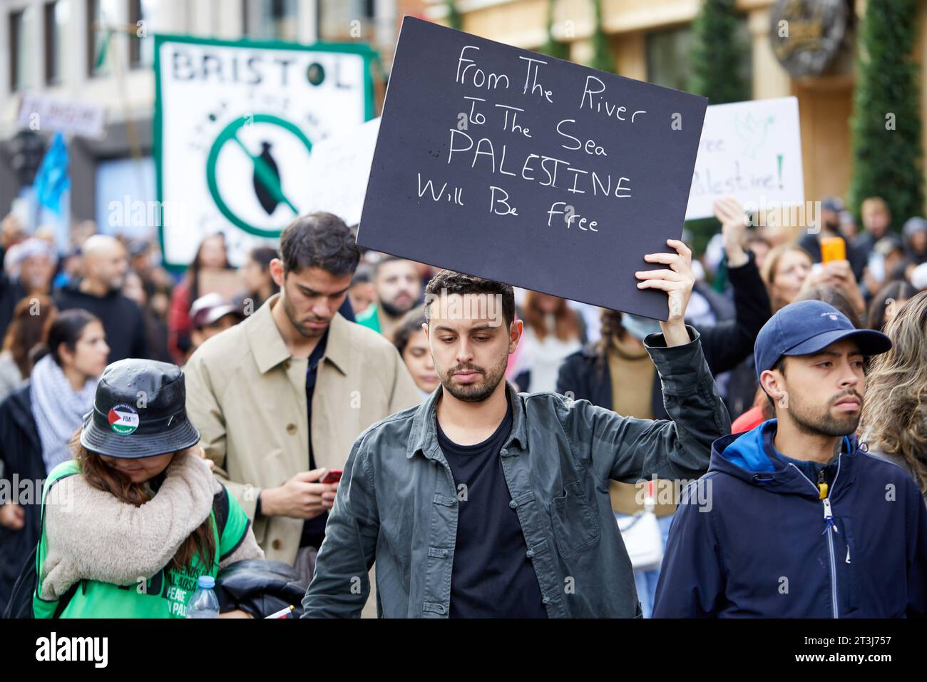 London, U.K. - 21 Oct 2023.: A protestor holds up a 'From the river to ...