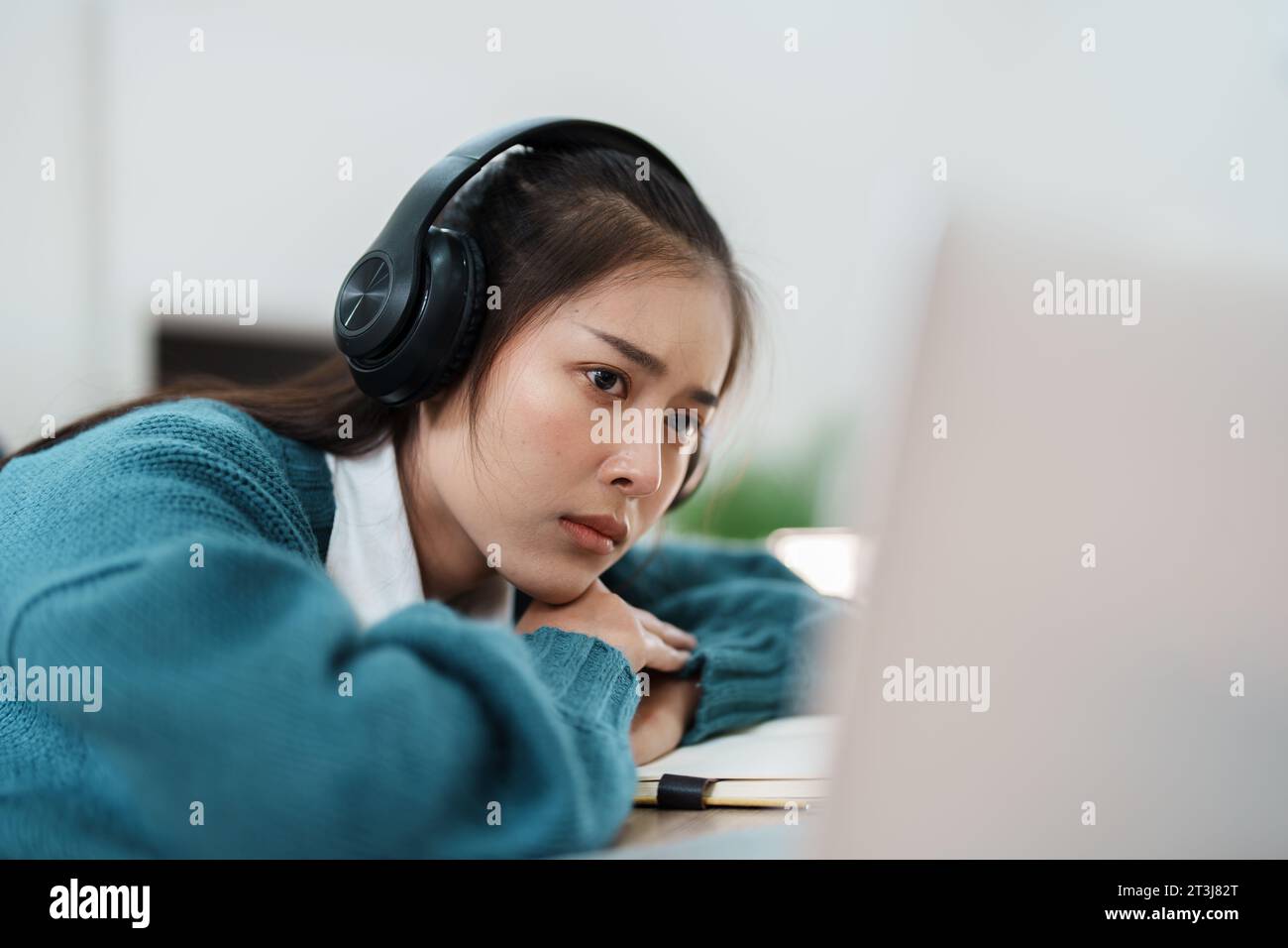 Studying online, beautiful Asian female student show symptoms burnout ...