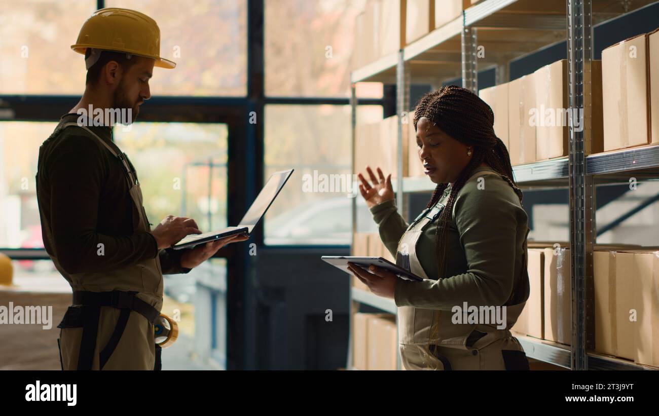 Knowldegeable workers performing warehouse inventory controls ...