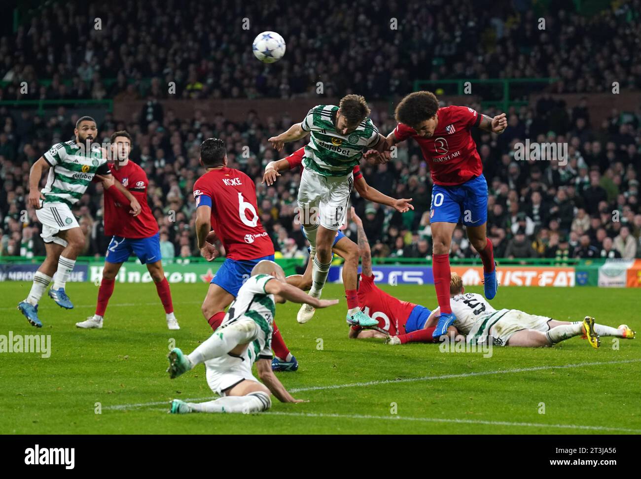 Celtic's Nathaniel Phillips and Atletico Madrid's Axel Witsel battle ...