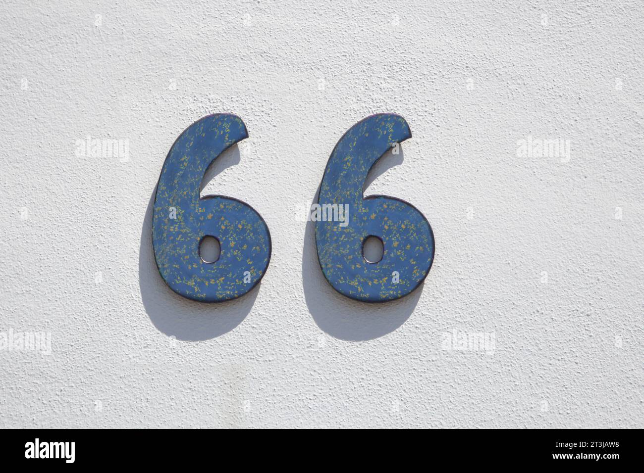 House number 66. Painted iron over whitewashed wall. Houses with ...