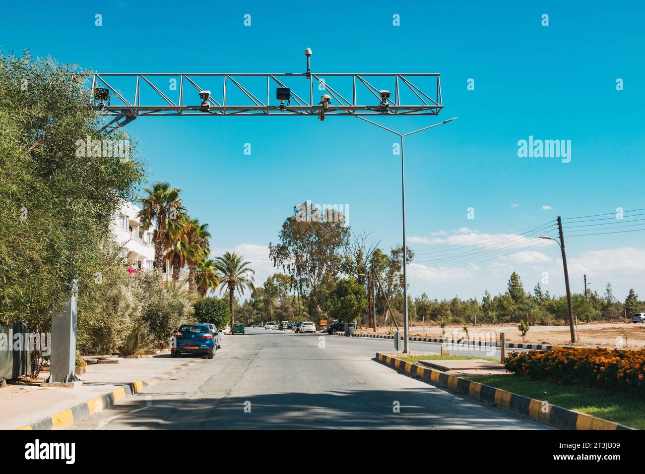 Cameras record the license plates of every passing vehicle on a road in ...