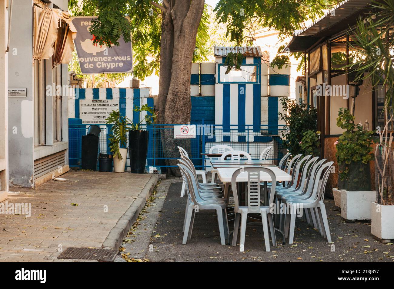 a street blocked by the wall and watchtower of the "Green Line" United ...