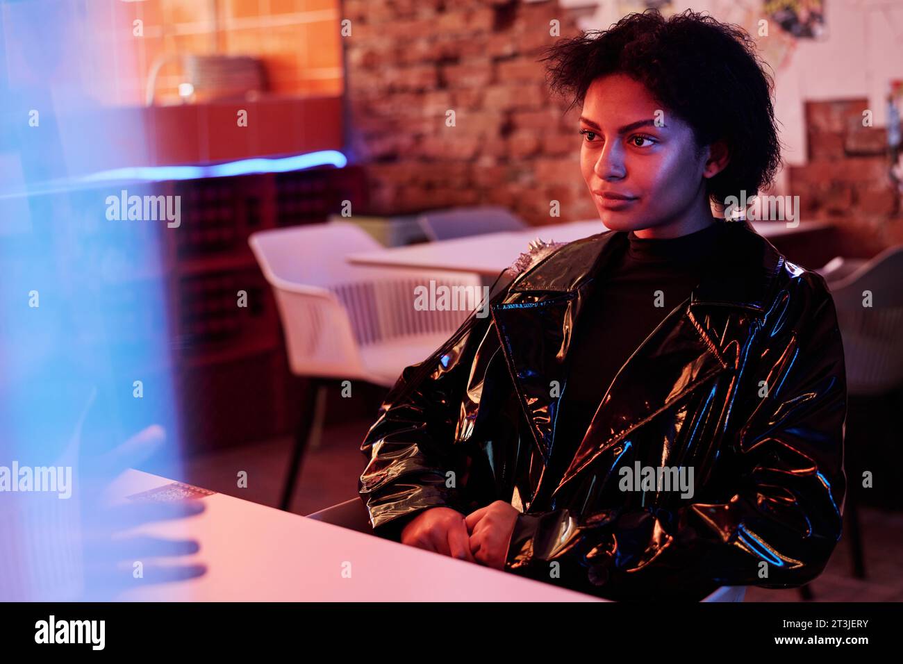 Young African American woman wearing black shiny varnished leather ...