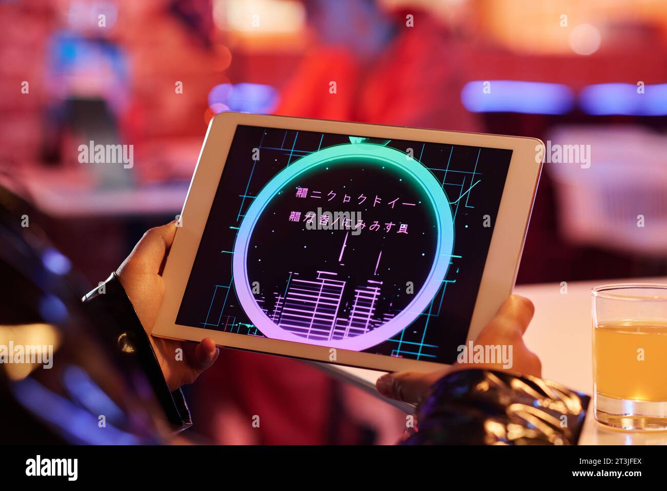 Screen of tablet with group of hieroglyphs in hands of young woman ...