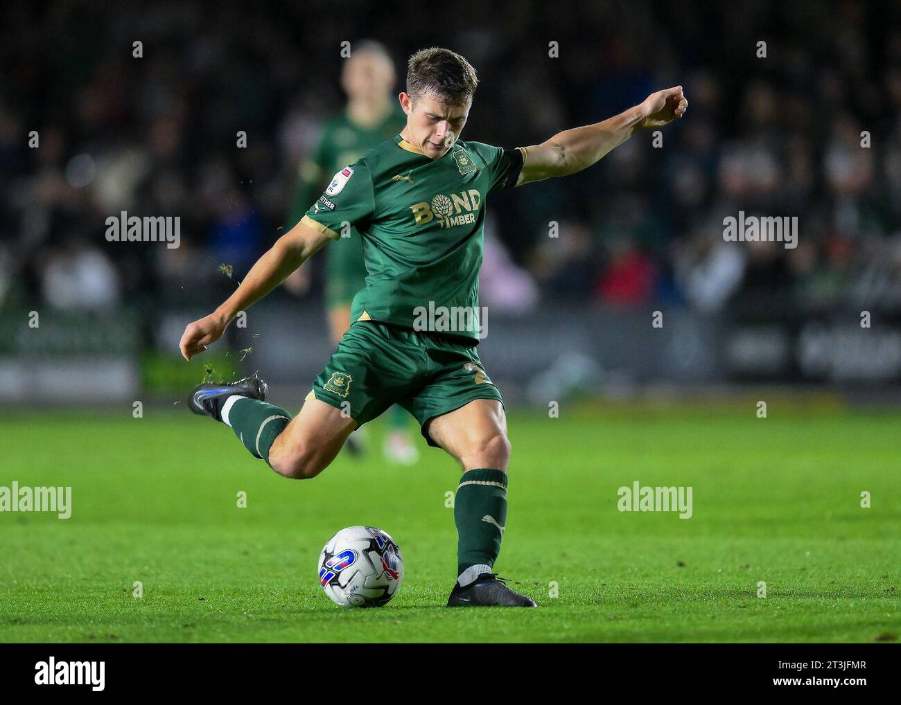 Adam Randell #20 of Plymouth Argyle takes a shoot and misses the target ...