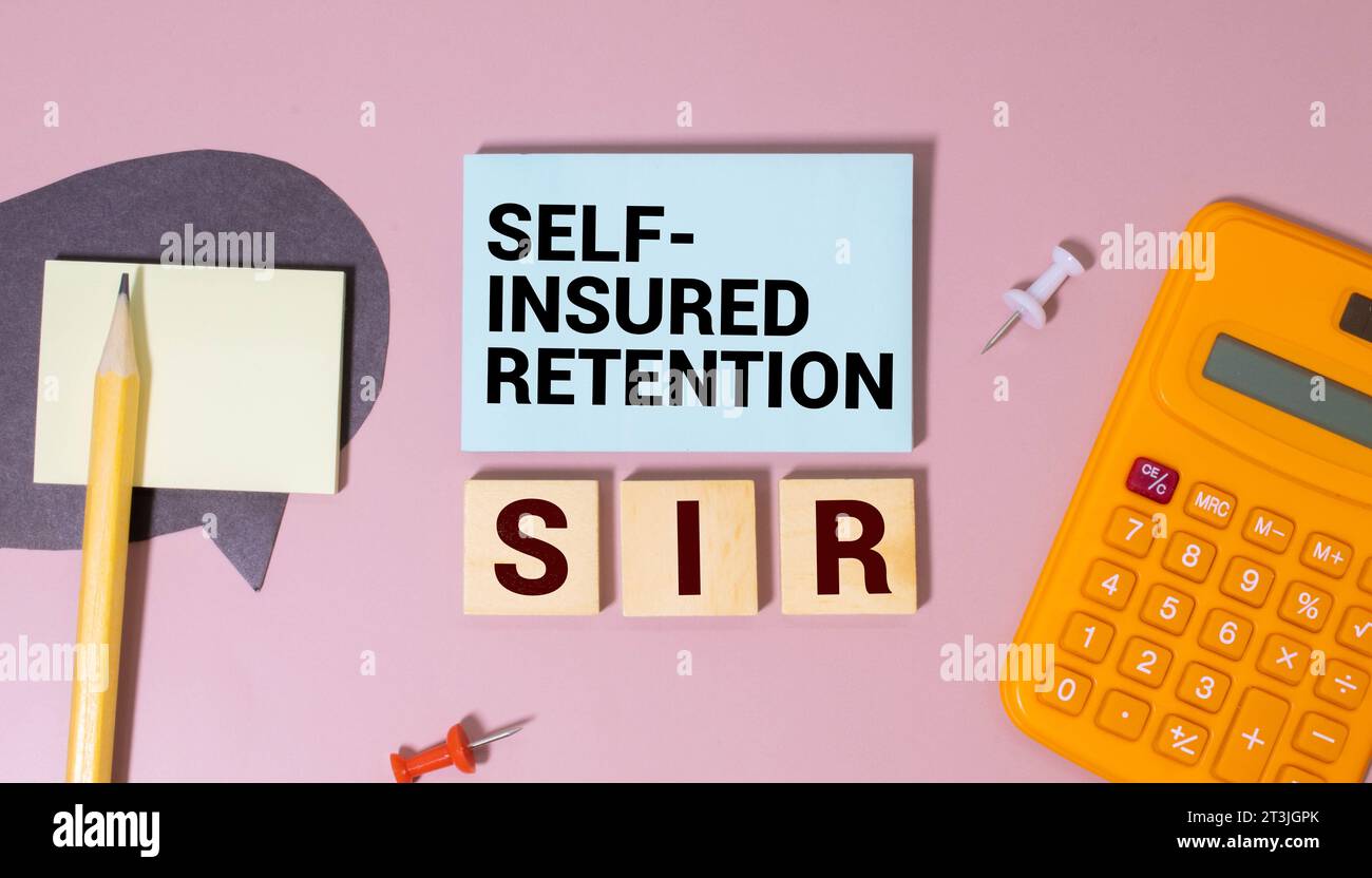Self-insured retention SIR insurance on a desk Stock Photo - Alamy