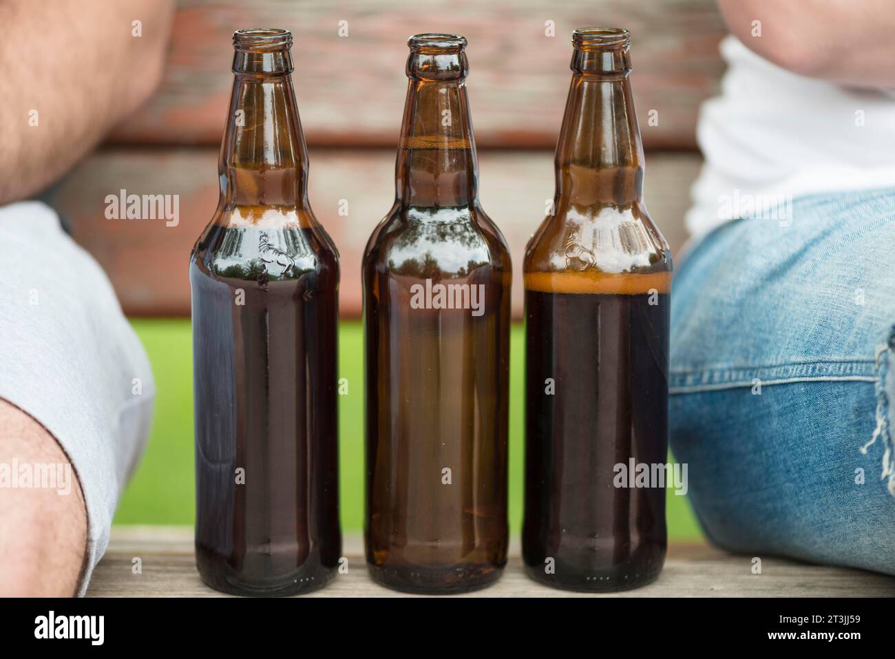 Bottles beer men Stock Photo - Alamy