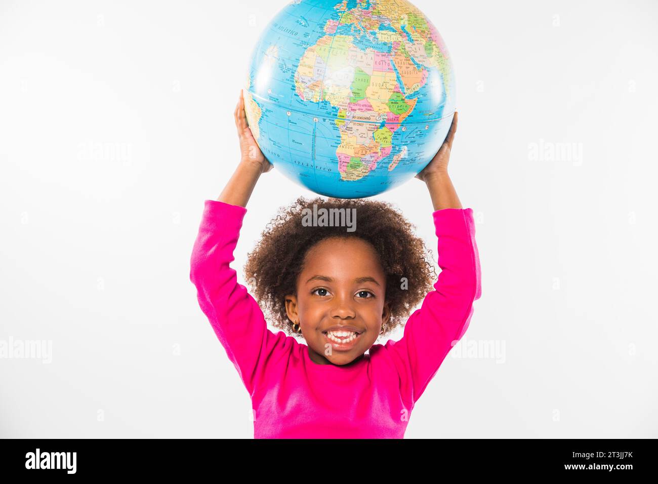 Child holding globe head studio Stock Photo - Alamy
