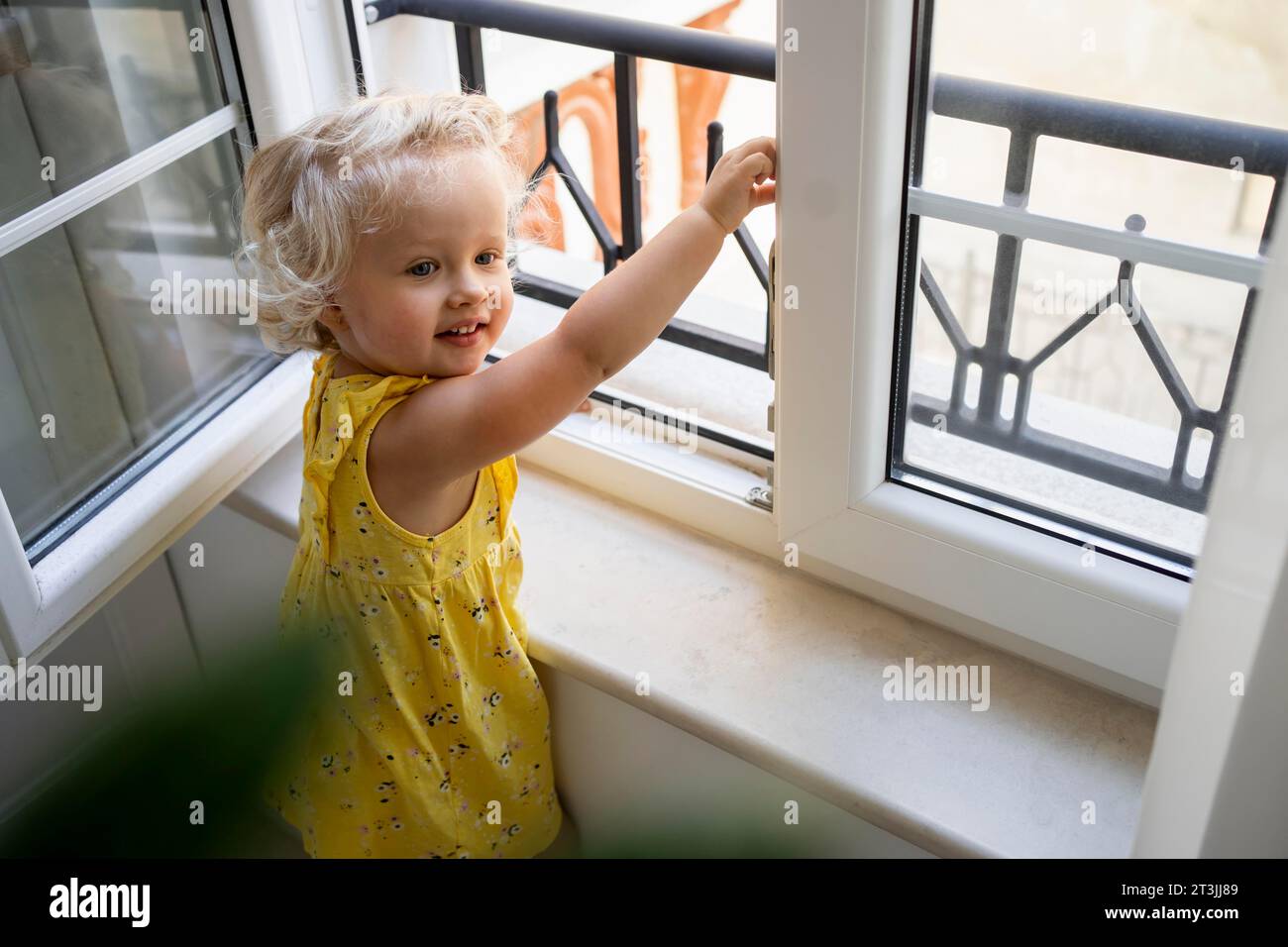 Child looking through window during quarantine Stock Photo - Alamy