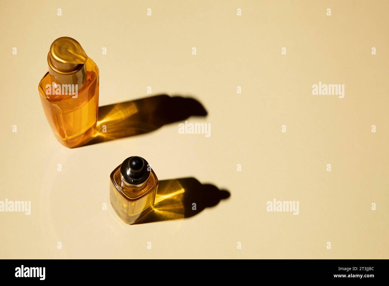 Bottles essential oil plain background Stock Photo - Alamy