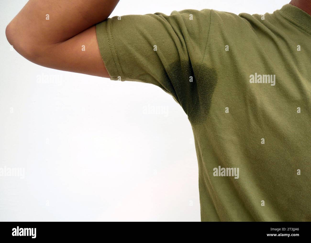 Hyperhidrosis sweating. Young Asian man with sweat stain on his clothes ...