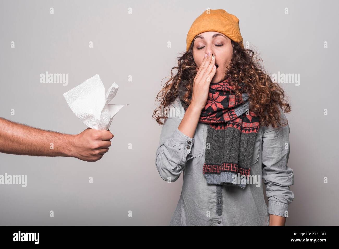 Close up hand giving tissue paper sick woman suffering from cold flu ...