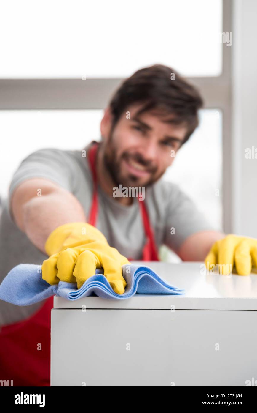 Concept man cleaning his home Stock Photo - Alamy