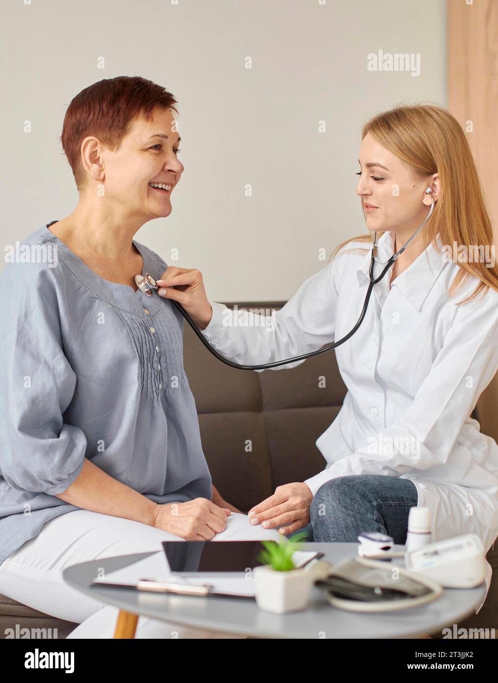 Covid recovery center female doctor checking elder patient s heartbeat ...