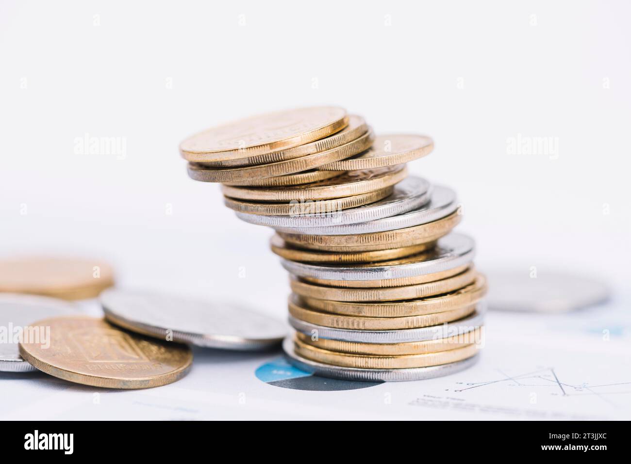 Fallen stack coins white background graph Stock Photo - Alamy