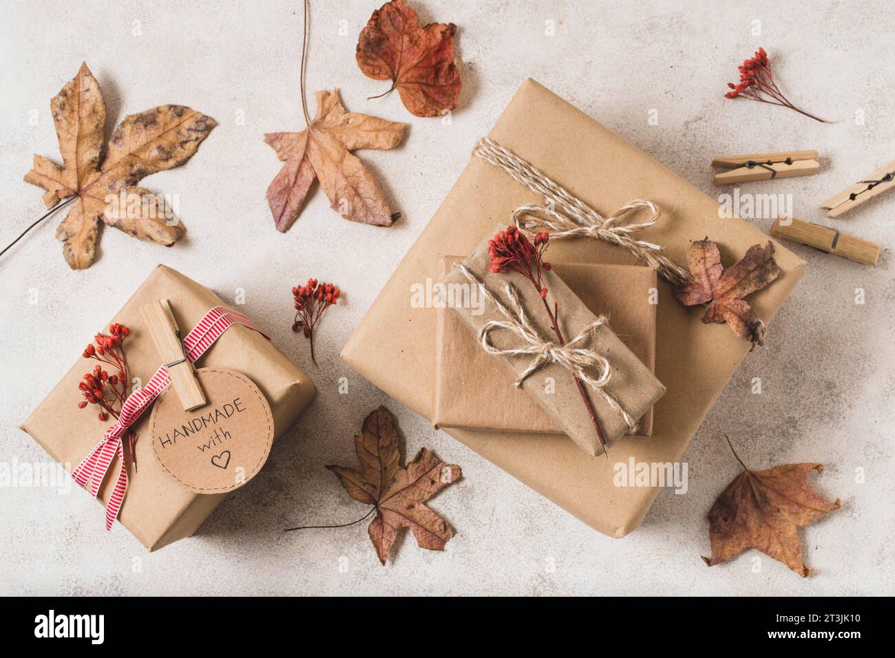 Flat lay gift boxes with dead leaves clothing pins Stock Photo - Alamy