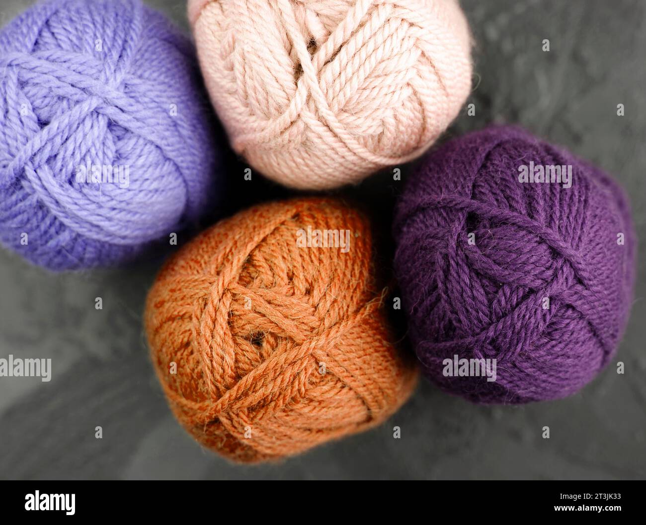 Flat lay orange purple wool yarn Stock Photo - Alamy