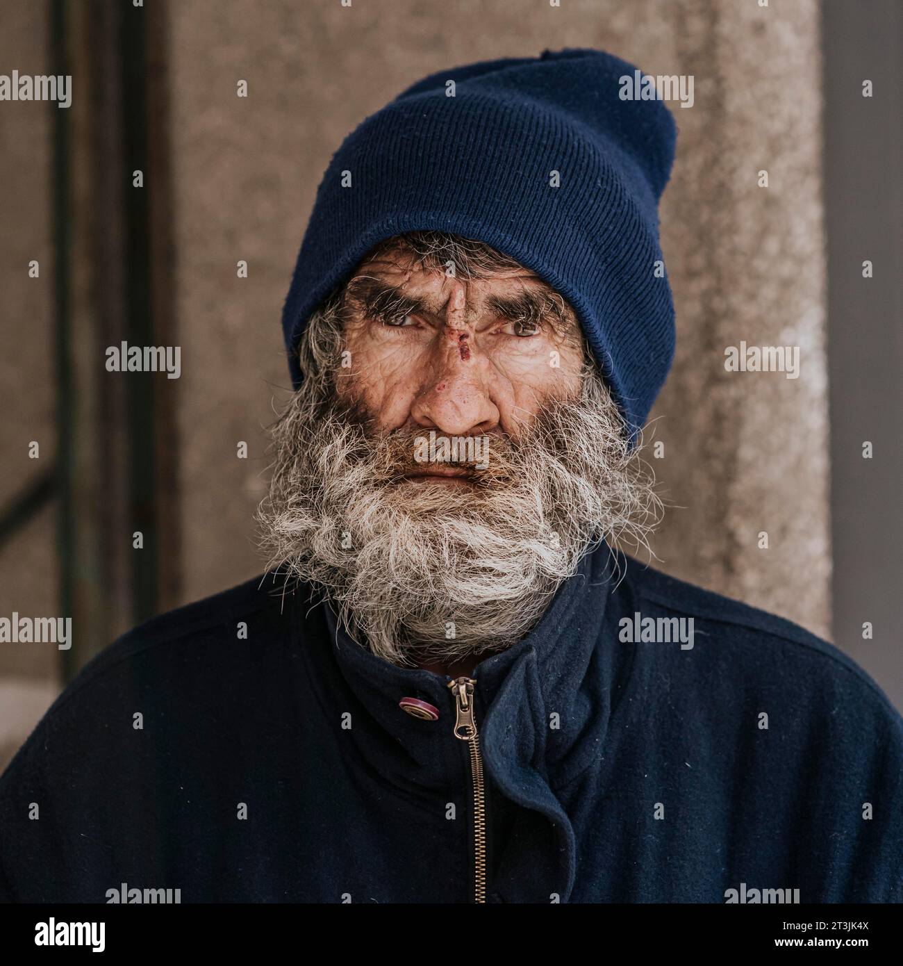 Front view homeless man with beard outdoors Stock Photo - Alamy