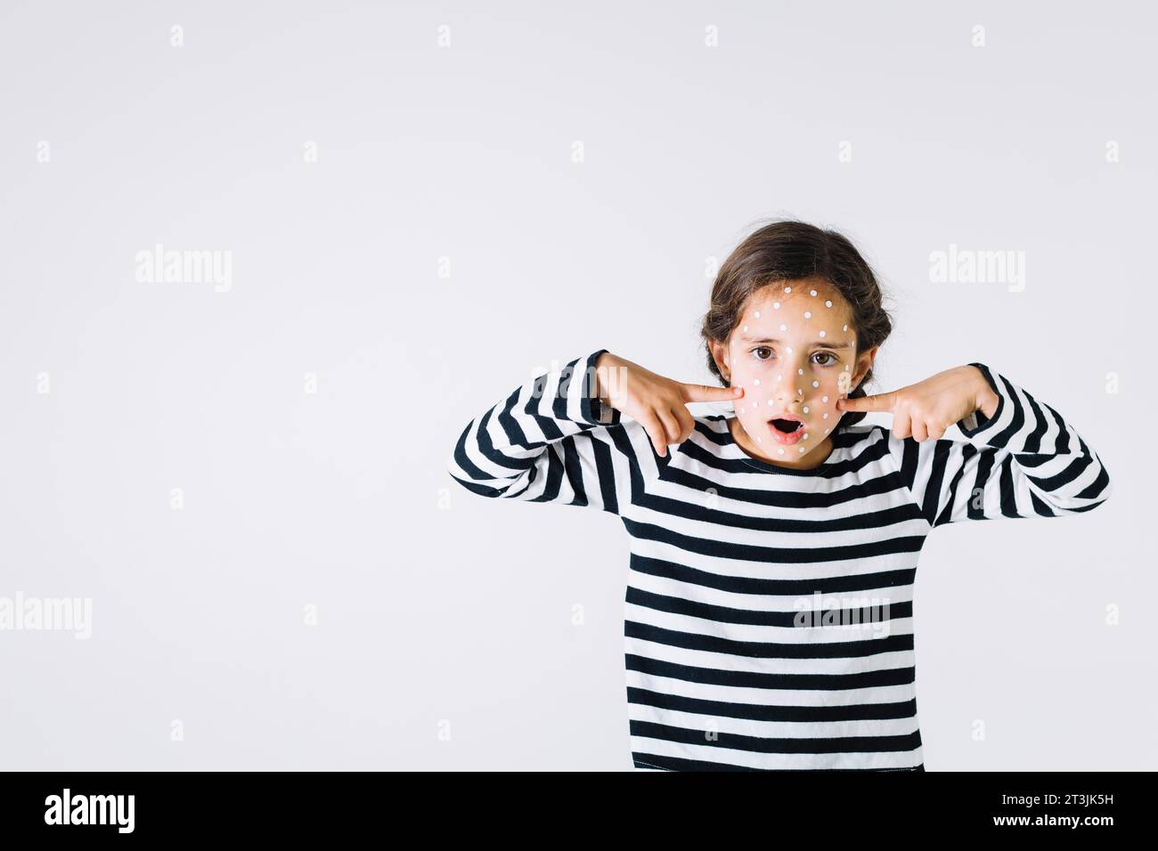 Girl with rush pointing face Stock Photo - Alamy