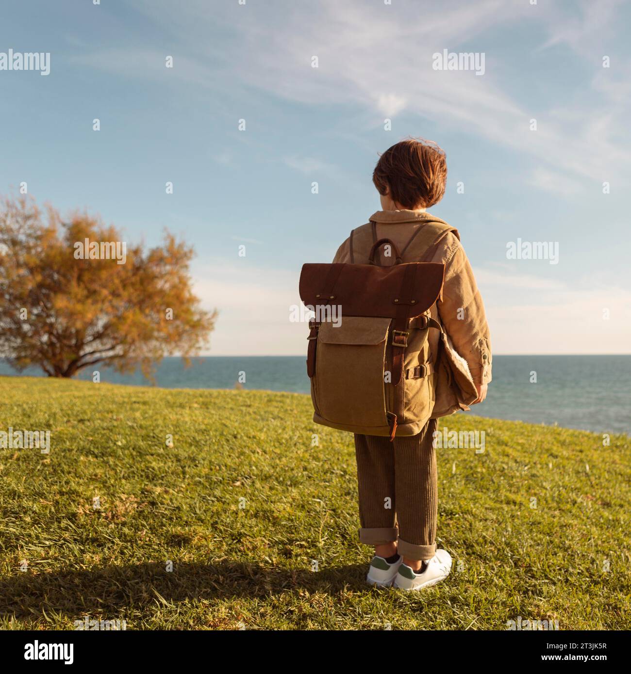 Full shot boy wearing backpack Stock Photo - Alamy