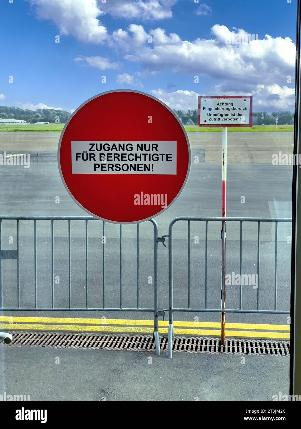 Round red prohibition sign on glass door Access only for authorised ...