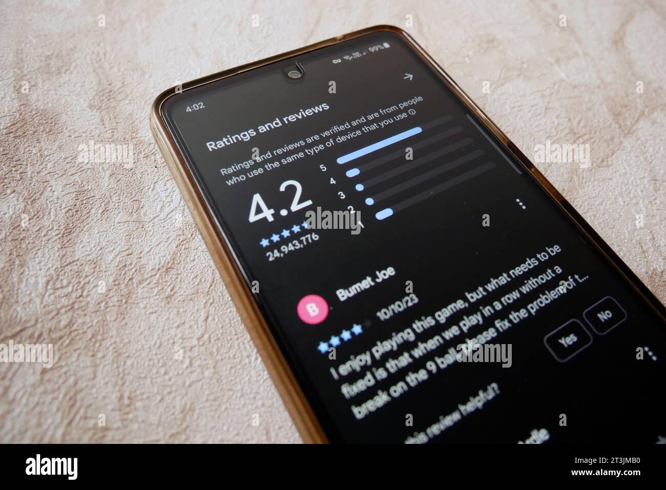 Rating and Review of an application on Google Play Store Stock Photo ...