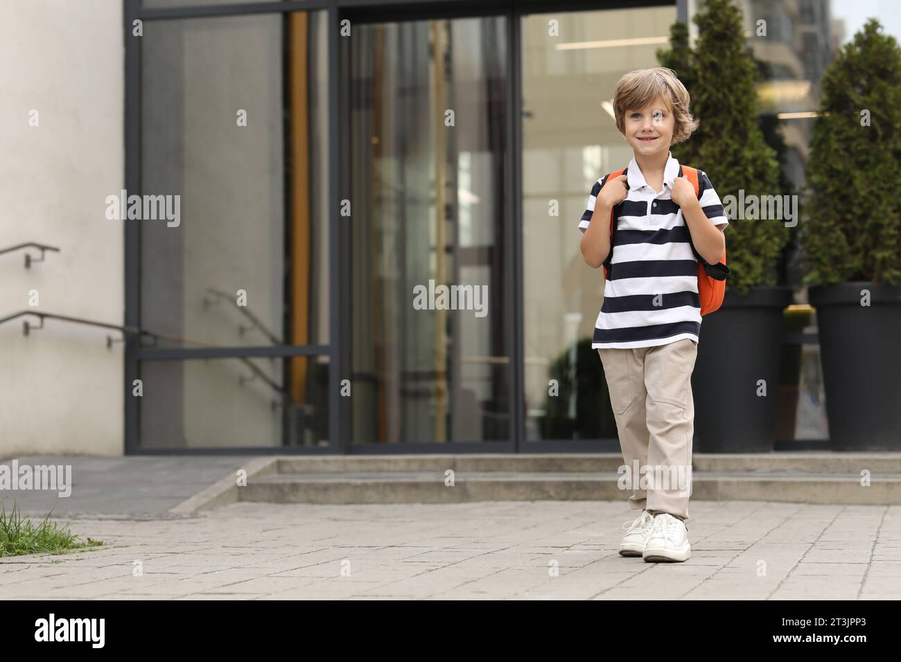 Portrait of little boy walking to kindergarten outdoors. Space for text ...