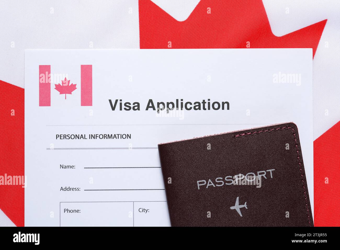 Immigration to Canada. Visa application form and passport on flag, top ...