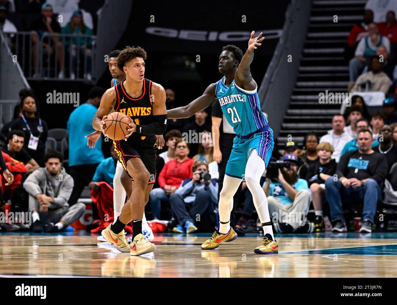 Charlotte Hornets forward JT Thor (21) defends Atlanta Hawks forward ...