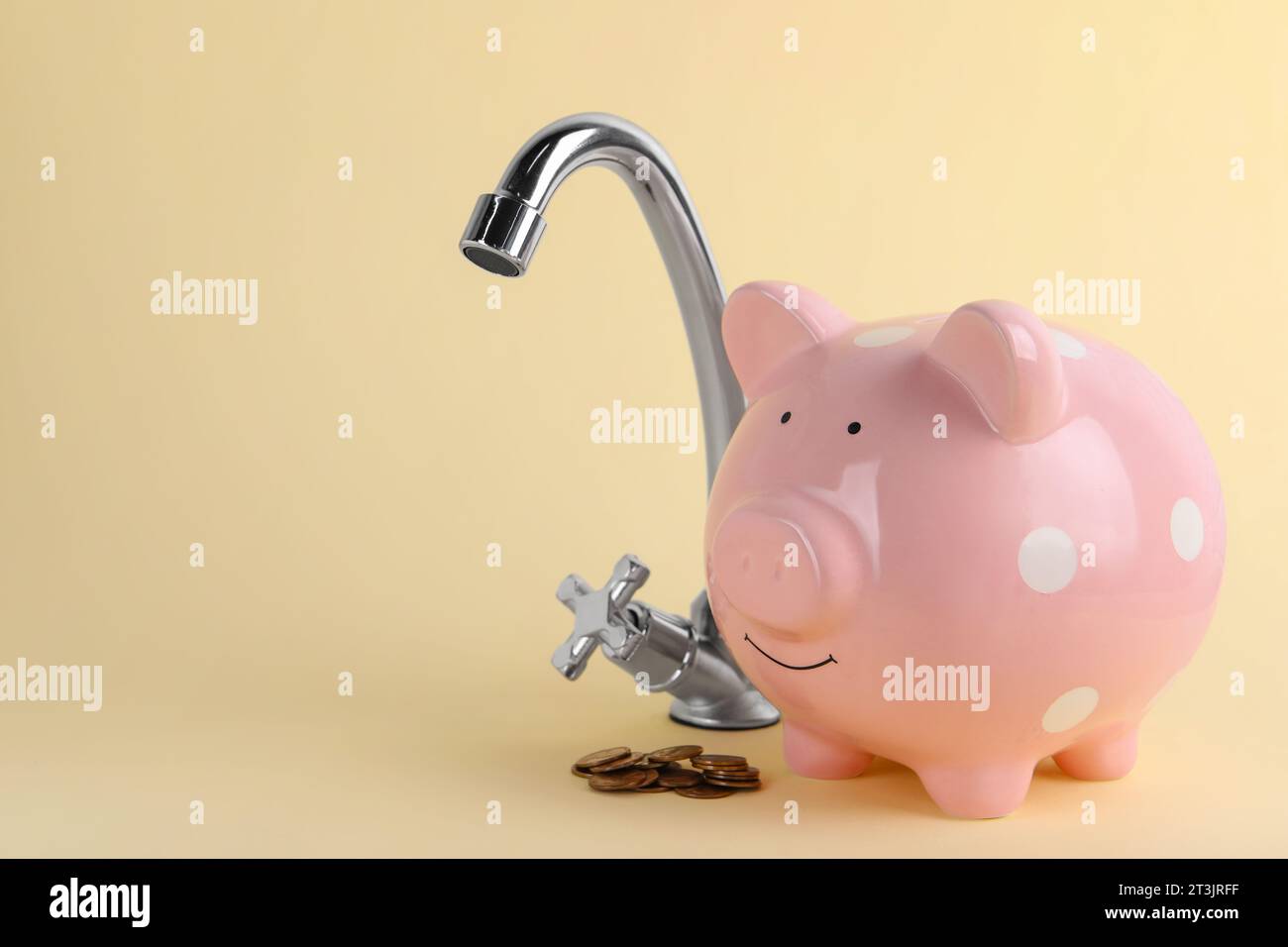 Water scarcity concept. Piggy bank, tap and coins on beige background ...