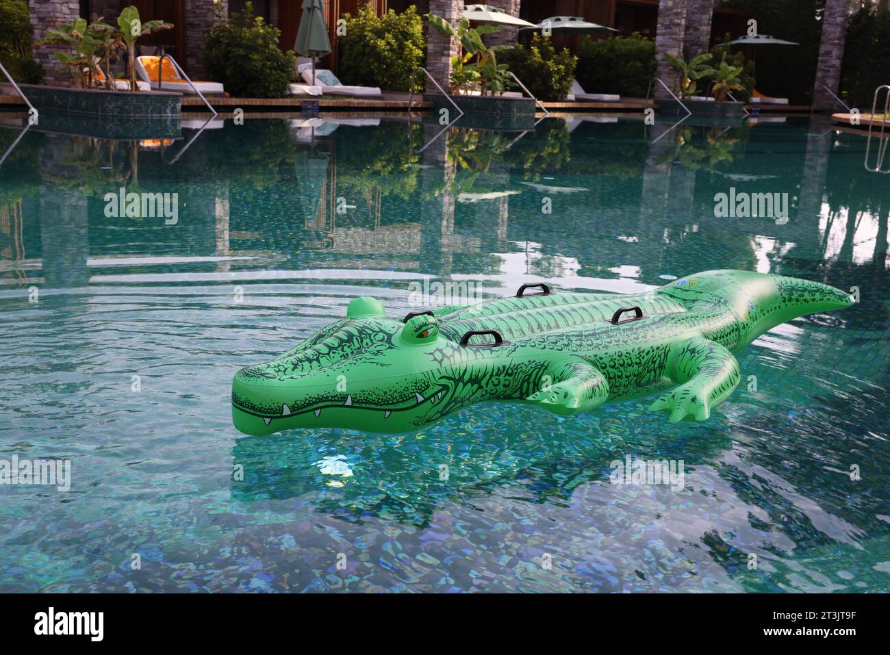 Float in shape of crocodile in swimming pool at luxury resort Stock ...