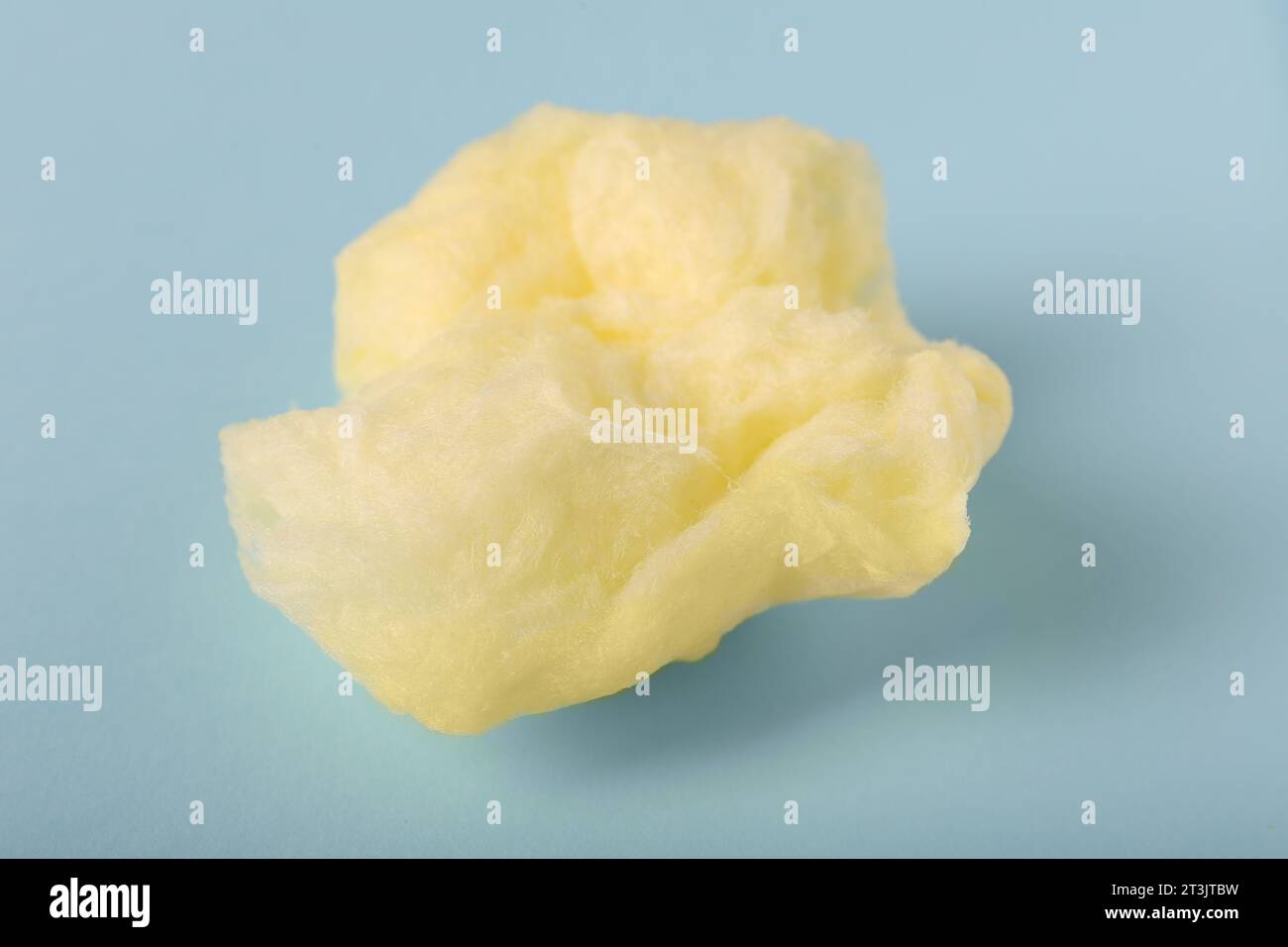 Sweet cotton candy on light blue background, closeup Stock Photo - Alamy