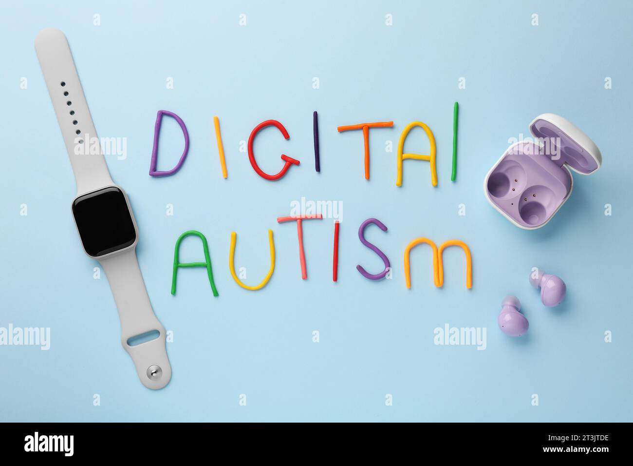 Phrase Digital Autism made of colorful plasticine, smartwatch and ...