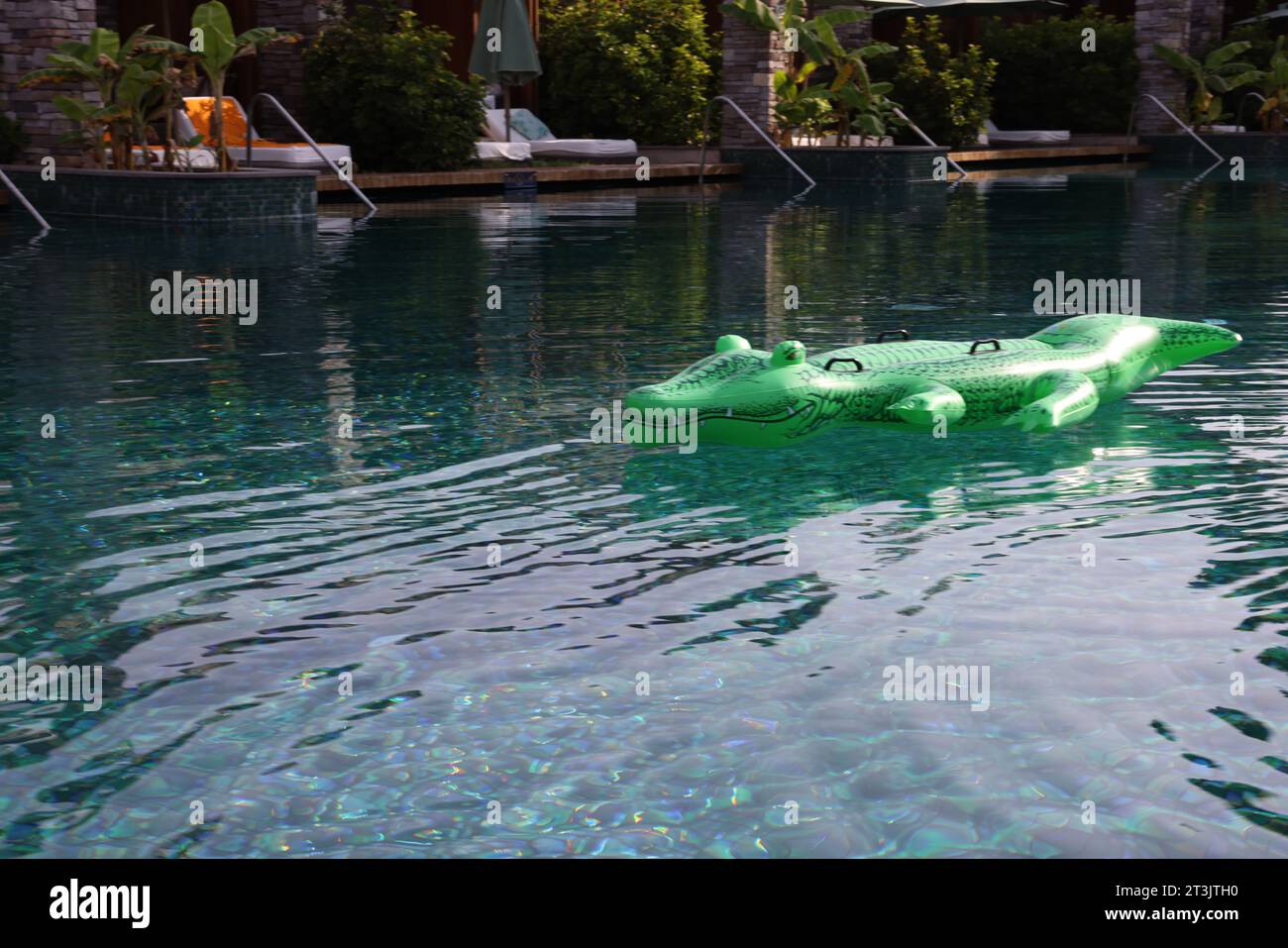 Float in shape of crocodile in swimming pool at luxury resort Stock ...