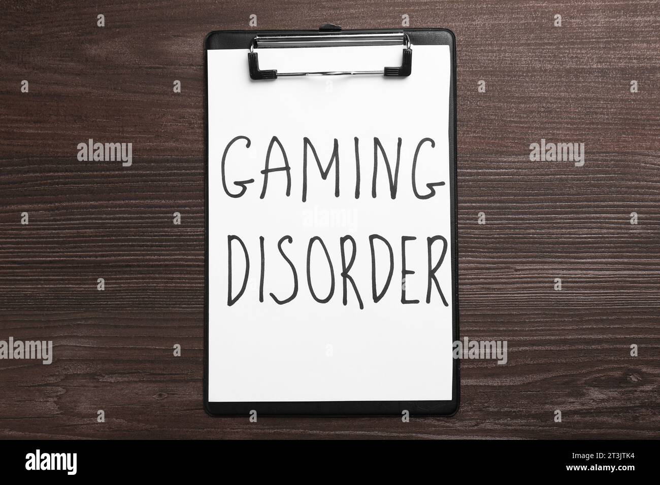Clipboard with phrase Gaming Disorder on wooden table, top view Stock ...