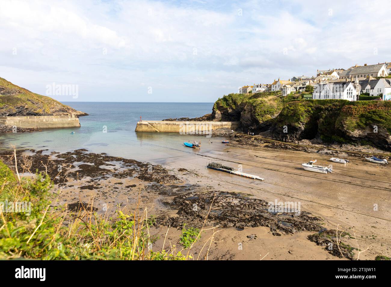 Port Isaac Cornwall harbour entrance and beach at low tide, white ...