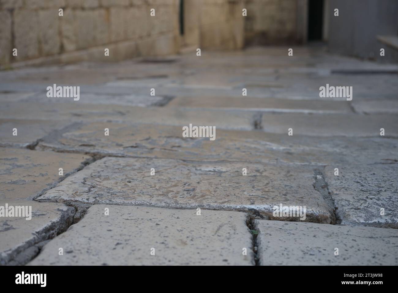 View of street tiles in town. Alleyway covering Stock Photo - Alamy