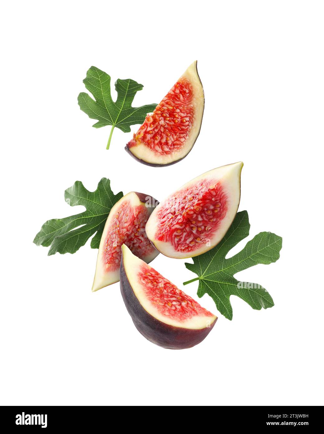 Piece of fresh fig and green leaves falling on white background Stock ...
