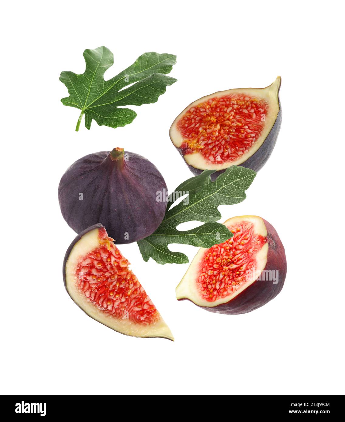 Fresh figs and green leaves falling on white background Stock Photo - Alamy