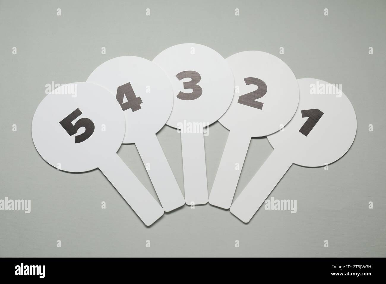 Auction paddles with numbers on light grey background, flat lay Stock ...